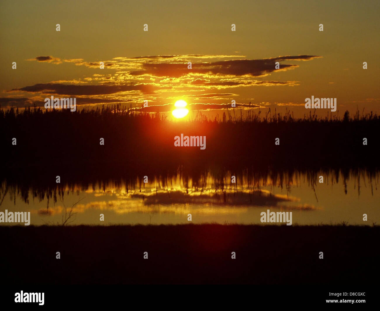 A breathtaking view of the sunset over a Canadian landscape, with the ...