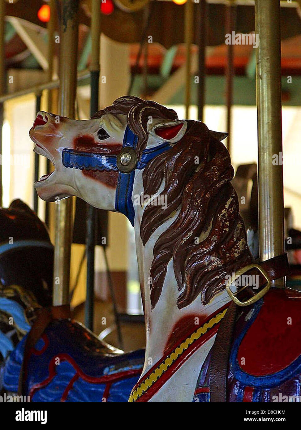 A colorful carousel with horse rides at an amusement park, a popular ...