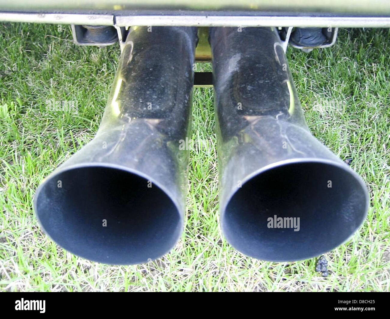 A close-up view of a car's exhaust system, highlighting its design and ...
