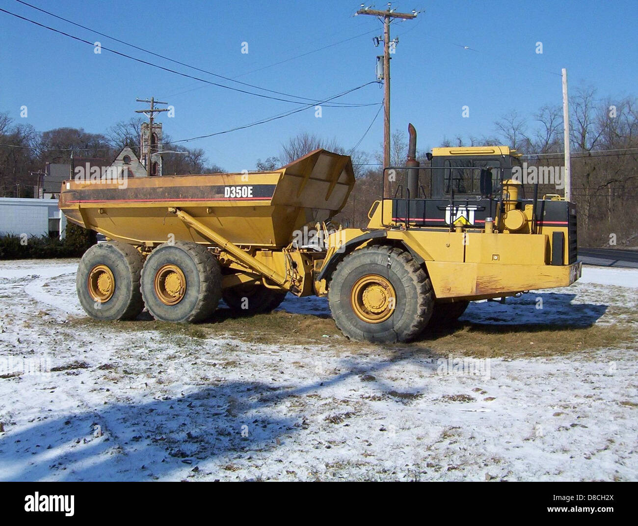 This image shows a Caterpillar dump truck, a heavy-duty vehicle used in ...