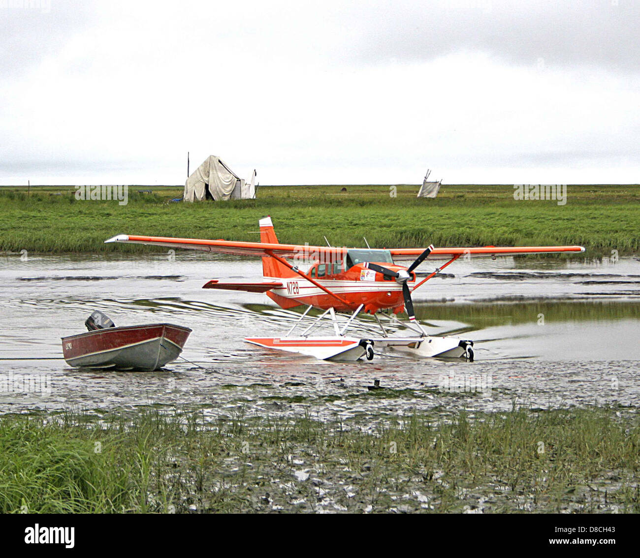 A Cessna floatplane, designed for water landings and takeoffs, on a ...
