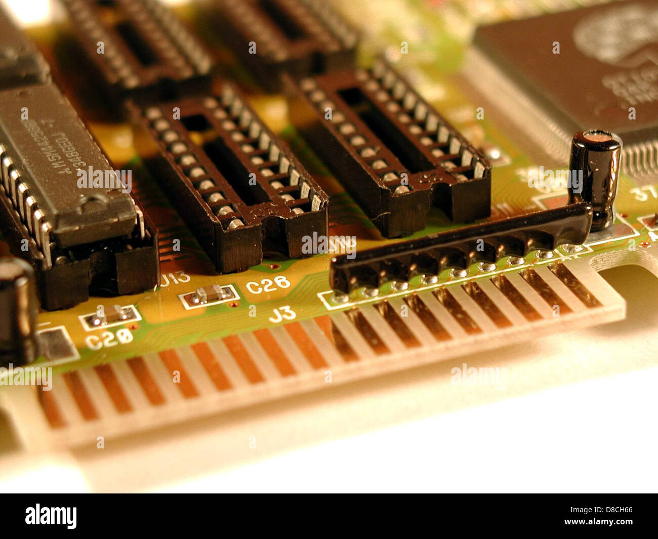 This image displays the intricate components of a computer mainboard ...