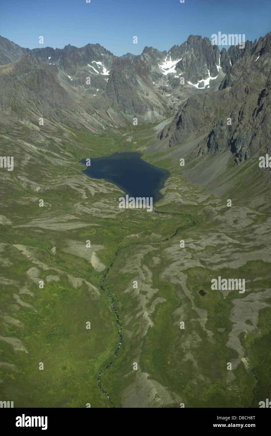 A classic U-shaped valley formed by the erosion of a mountain glacier ...