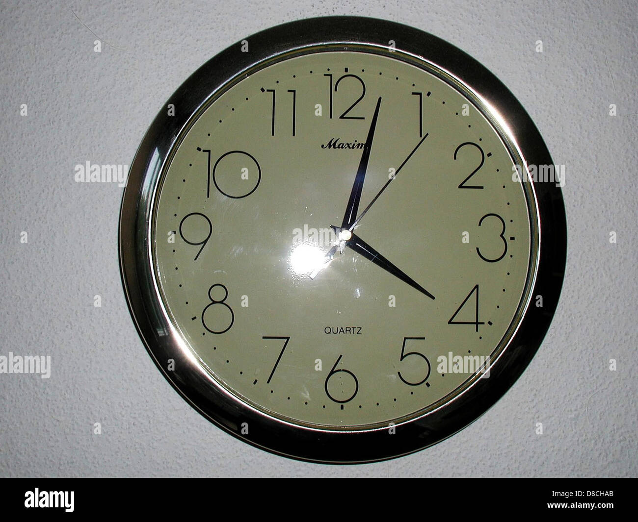An electronic clock, displaying time in a digital format, commonly used ...