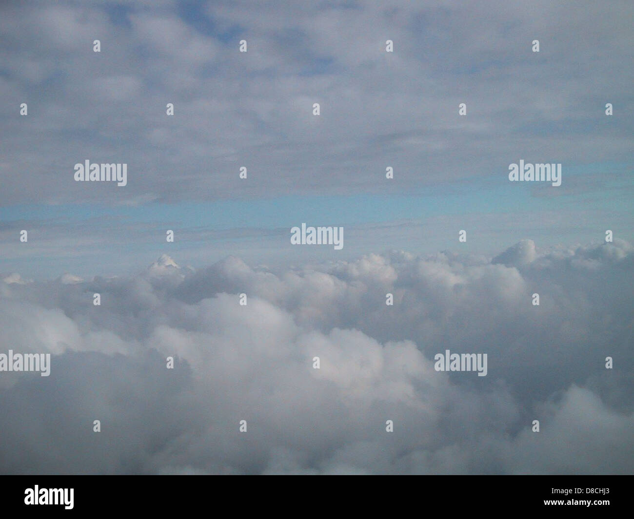 A serene image of soft, fluffy clouds scattered across the sky. The ...