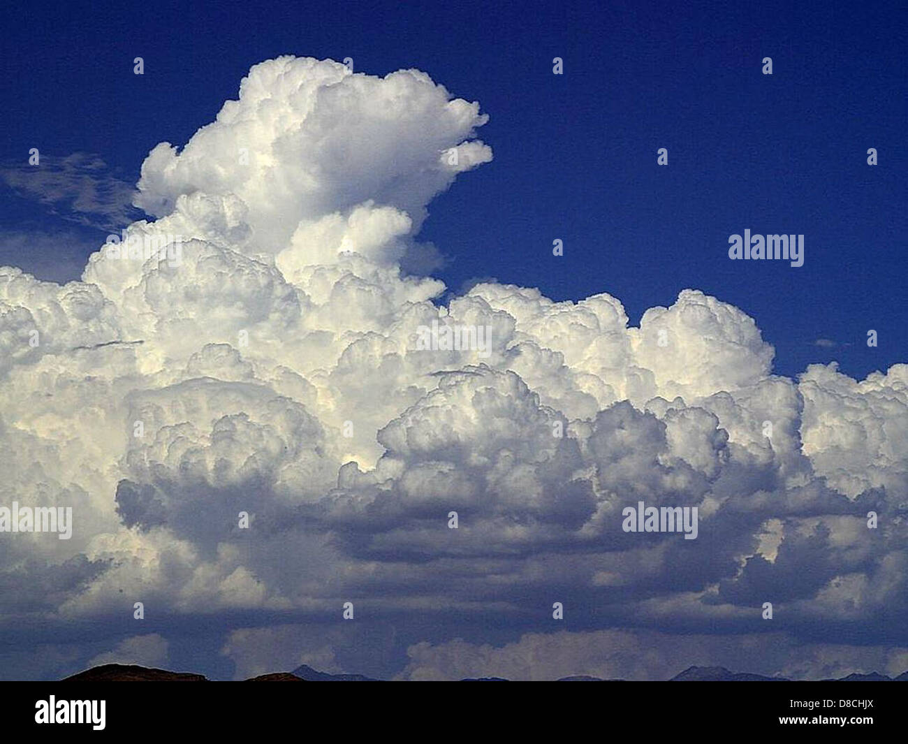 A dramatic scene of storm clouds gathering in the sky, indicating an ...