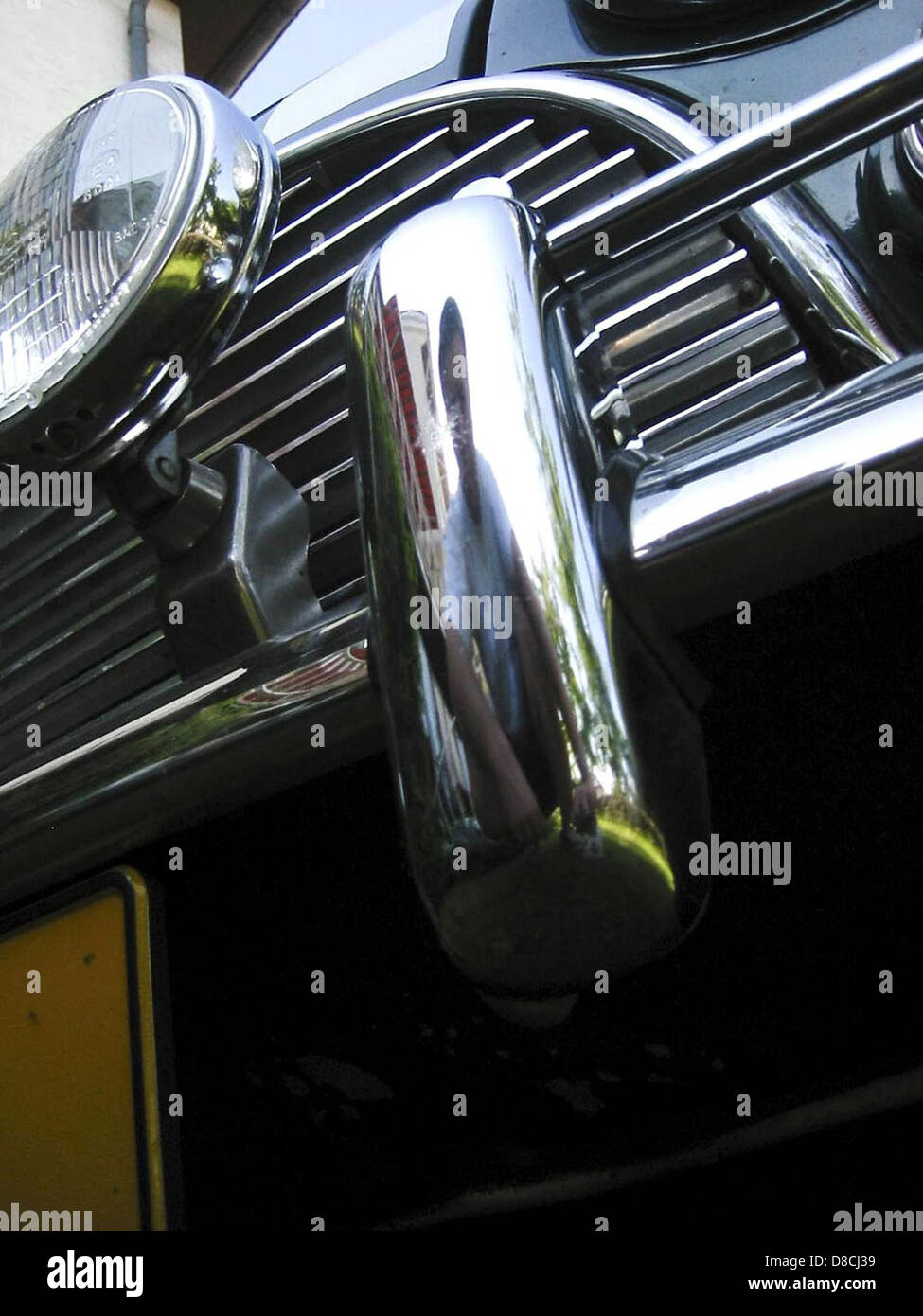 A close-up of a chrome part of a classic oldtimer car, showcasing the ...