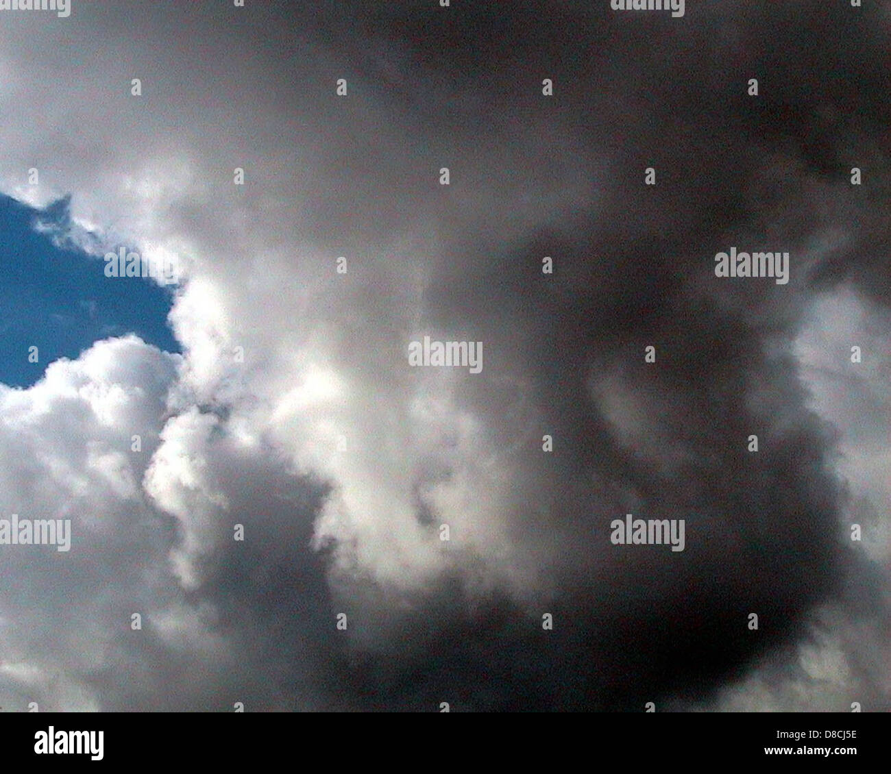 Dark clouds gather in the sky, signaling potential rain or storms. The ...