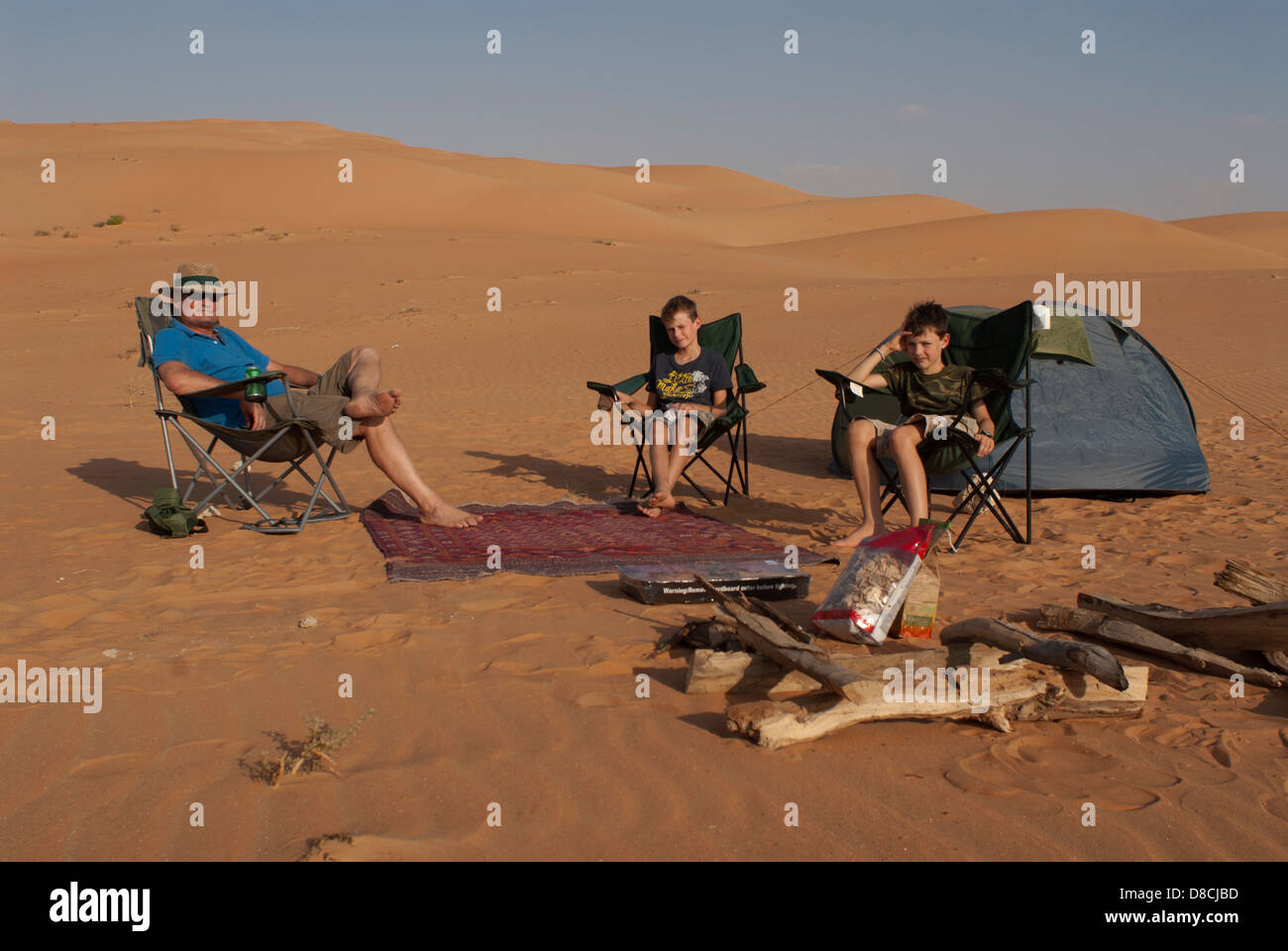 Family camping in desert, Abu Dhabi Stock Photo - Alamy