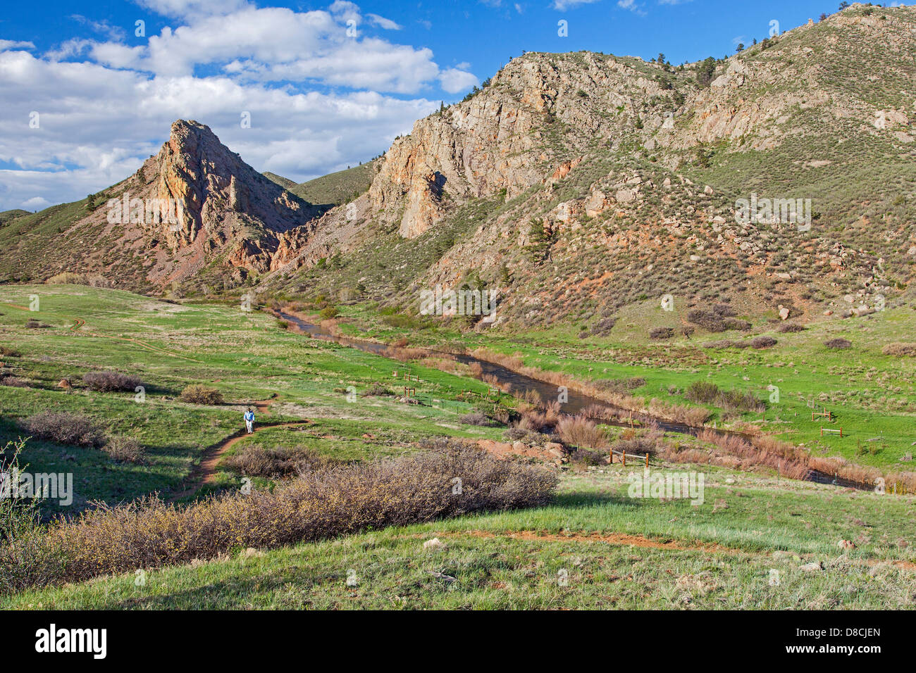 a lonely male hiker in a vast mountain ranch scenery - Eagle Nest Rock ...