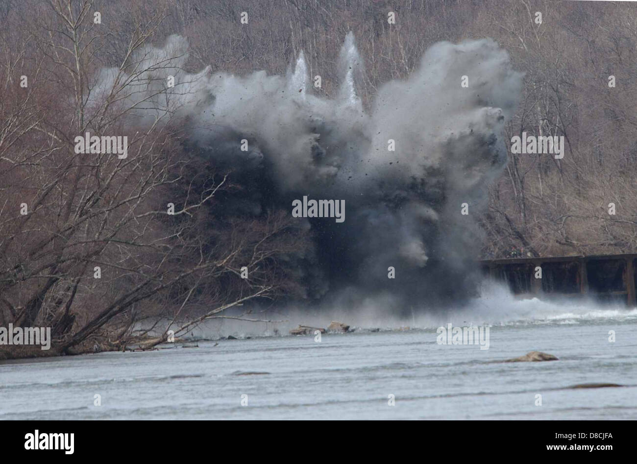 This image depicts the aftermath of the destruction of a river dam ...
