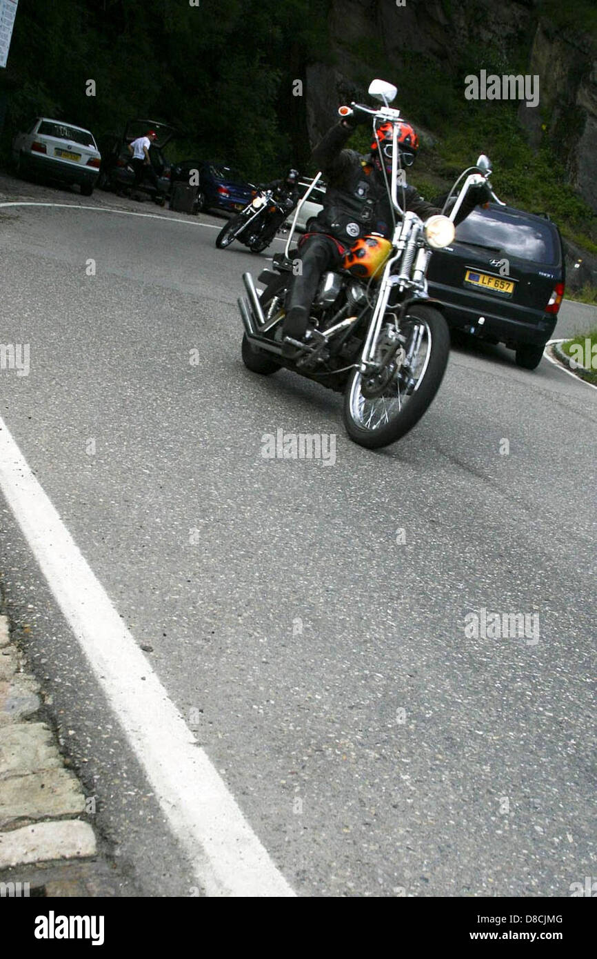 A photograph of a person riding a bicycle on a road, highlighting the ...