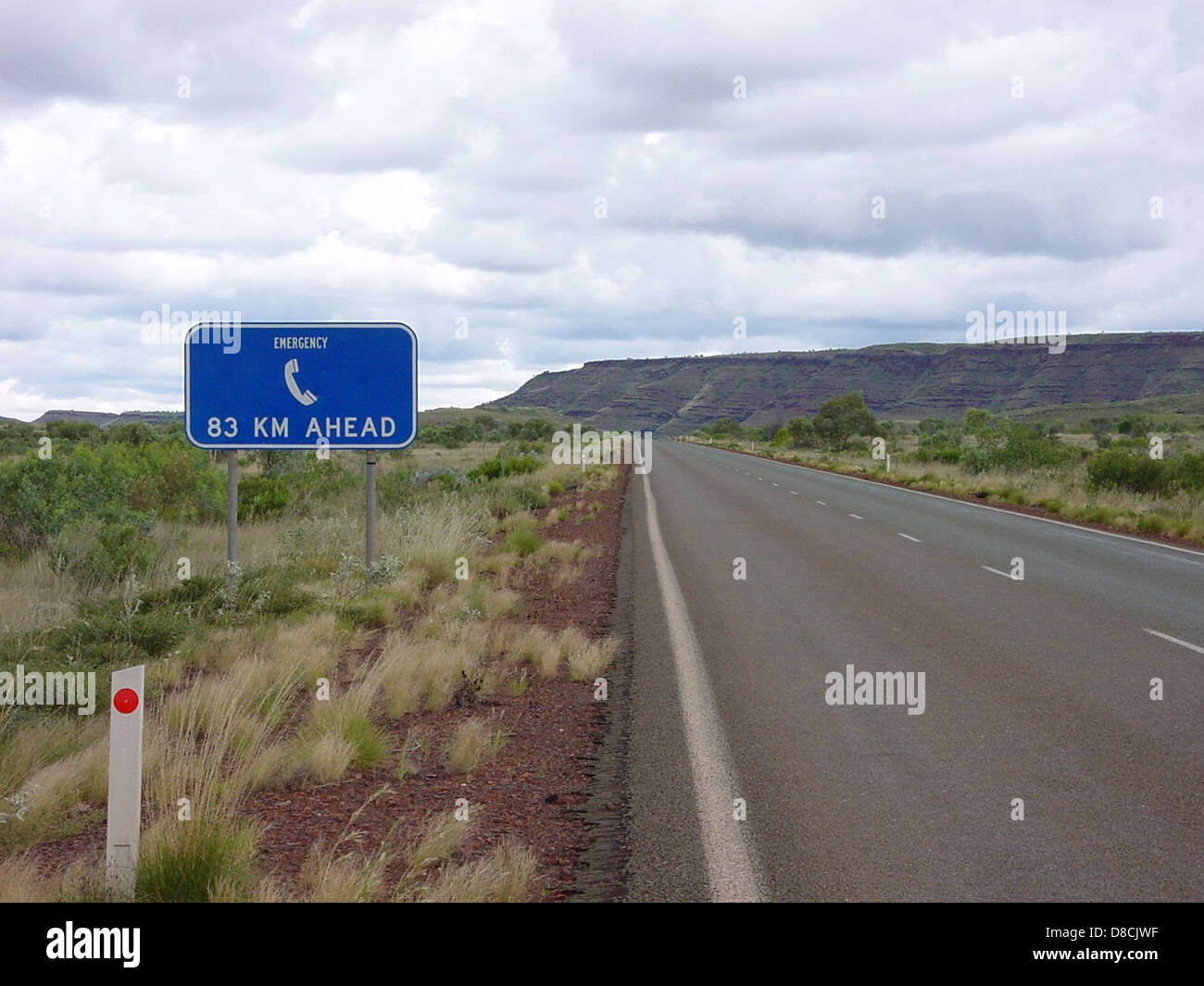 An emergency sign on the highway indicates a potential hazard or alert ...