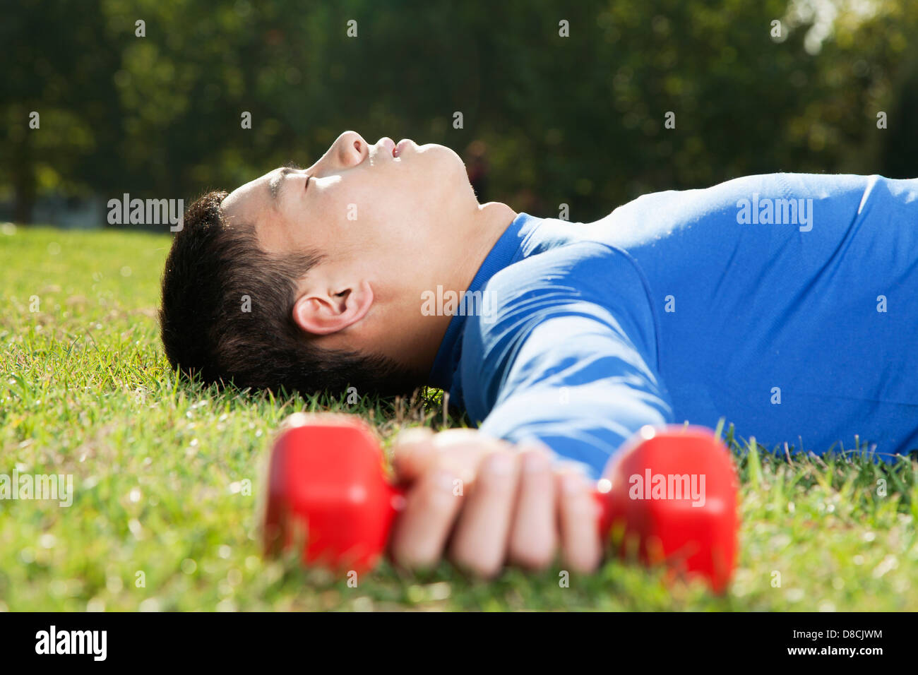 Young athletic man lying down hi-res stock photography and images - Alamy
