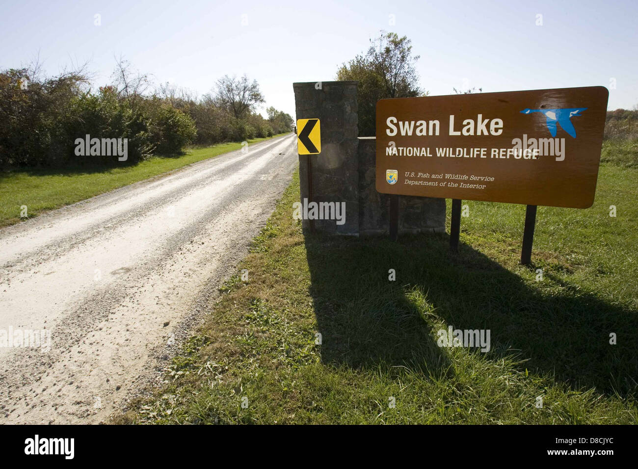 This image features an entrance sign for Swan Lake, indicating a ...