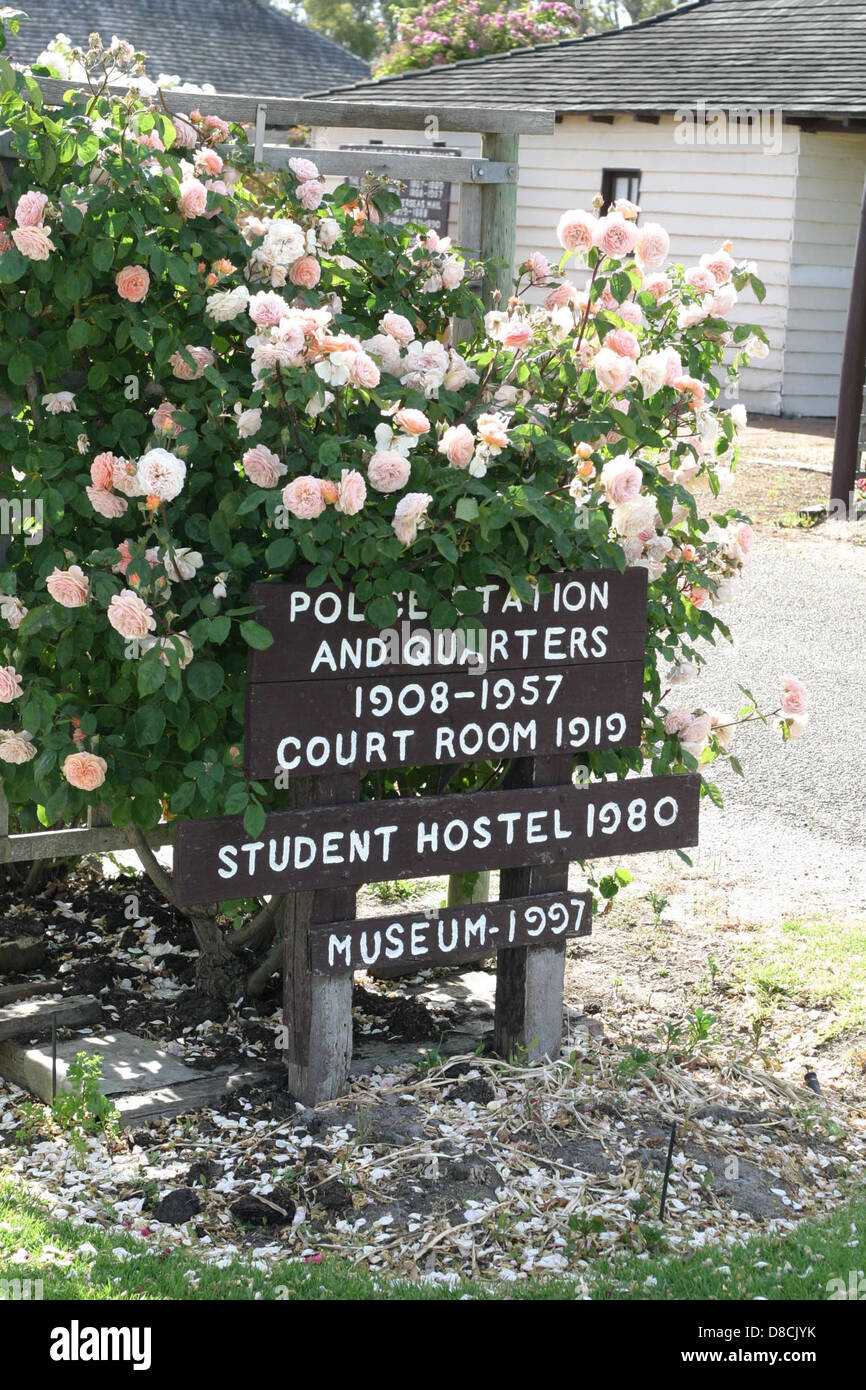 An entryway sign featuring decorative roses. The sign often serves as a ...
