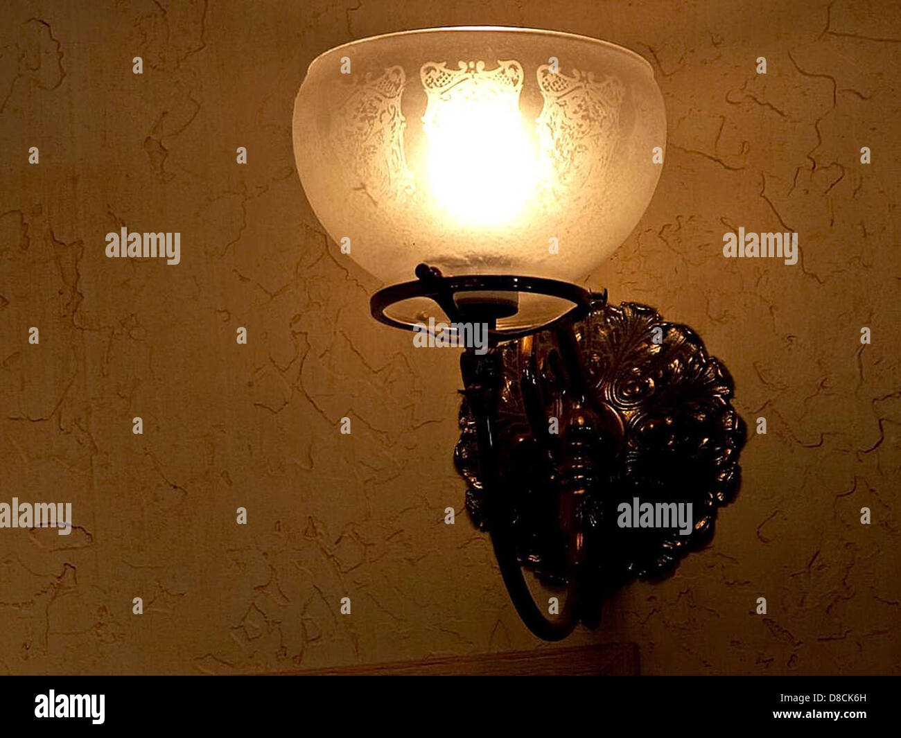 A decorative, fancy wall lamp designed to add a stylish touch to home ...