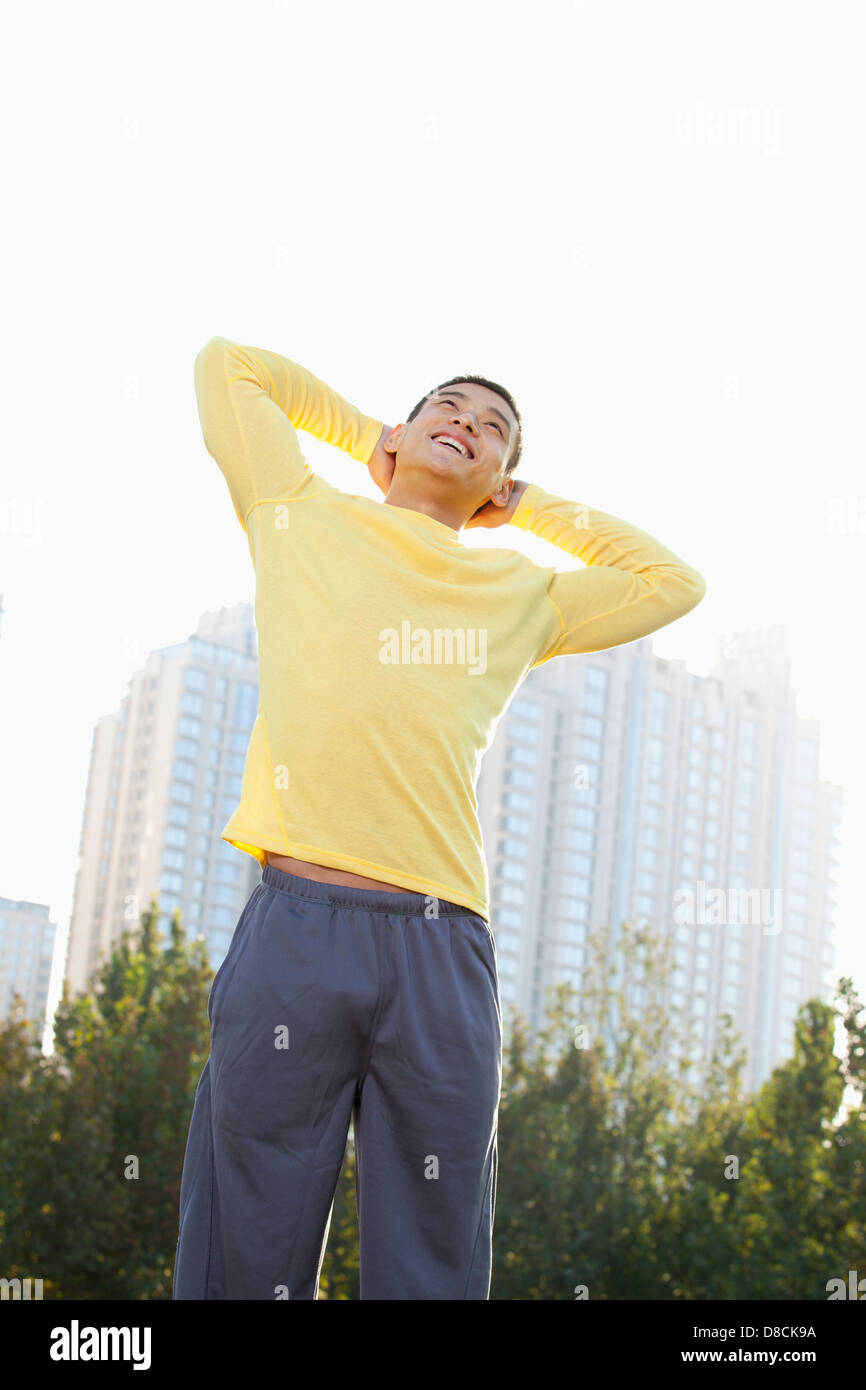 Young Athletic Man Standing in a Park in Beijing, Looking Up Stock ...