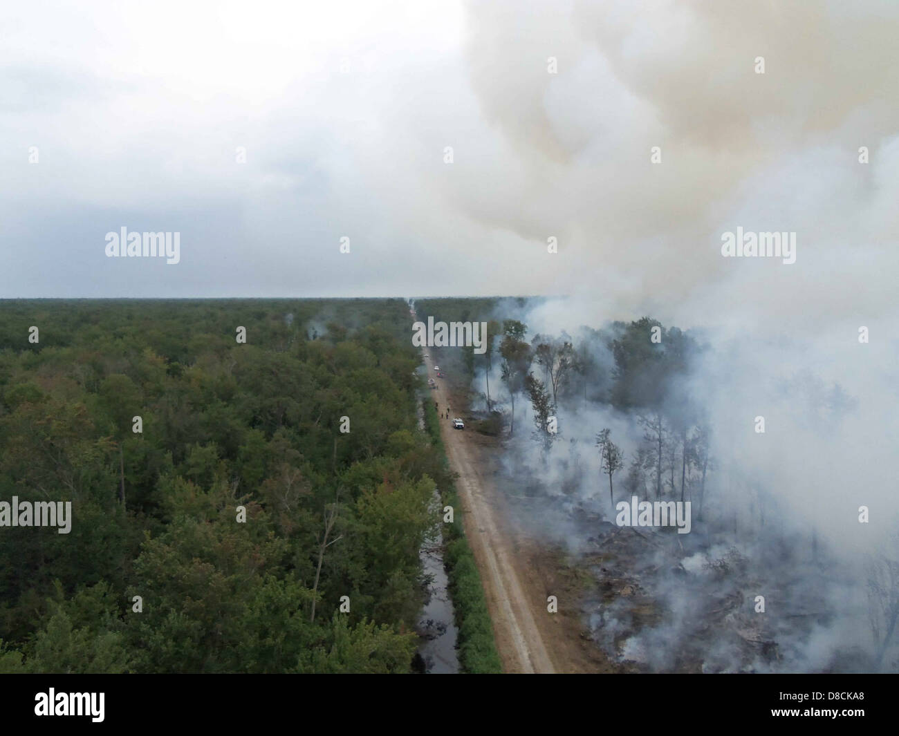 Firefighters work to hold the fire line Stock Photo - Alamy