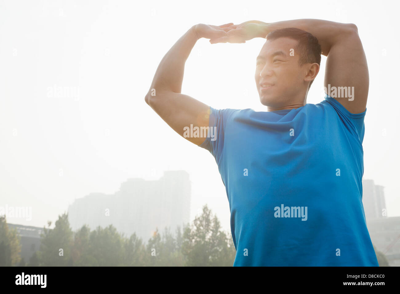 Young Muscular Man Stretching Stock Photo - Alamy
