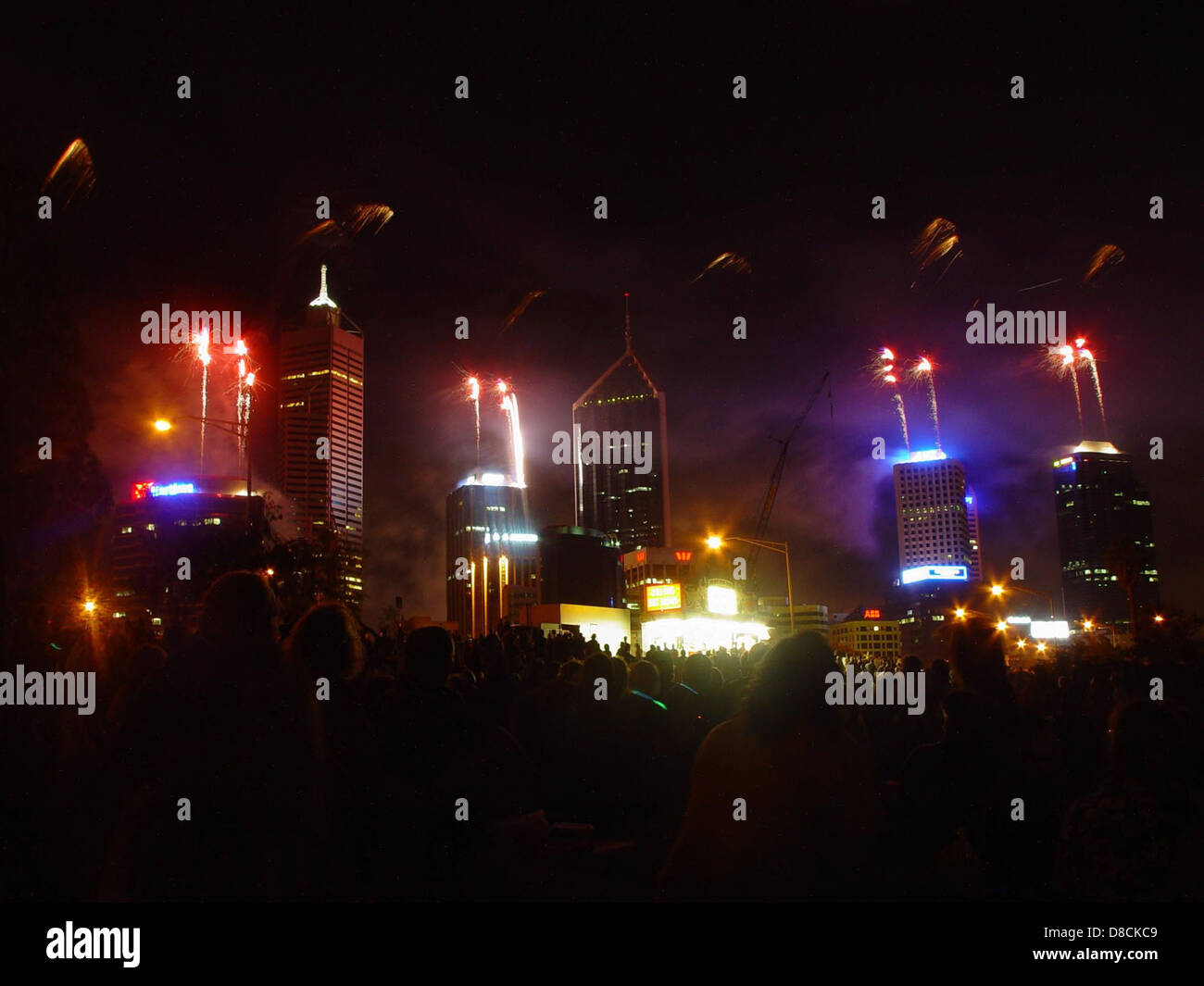 Fireworks erupting from buildings during a nighttime display, lighting ...
