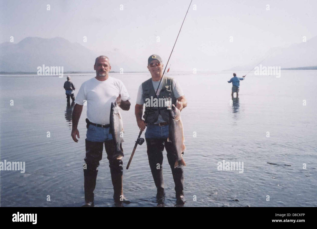 Fishermen proudly display their catch of silver salmon, a prized fish ...