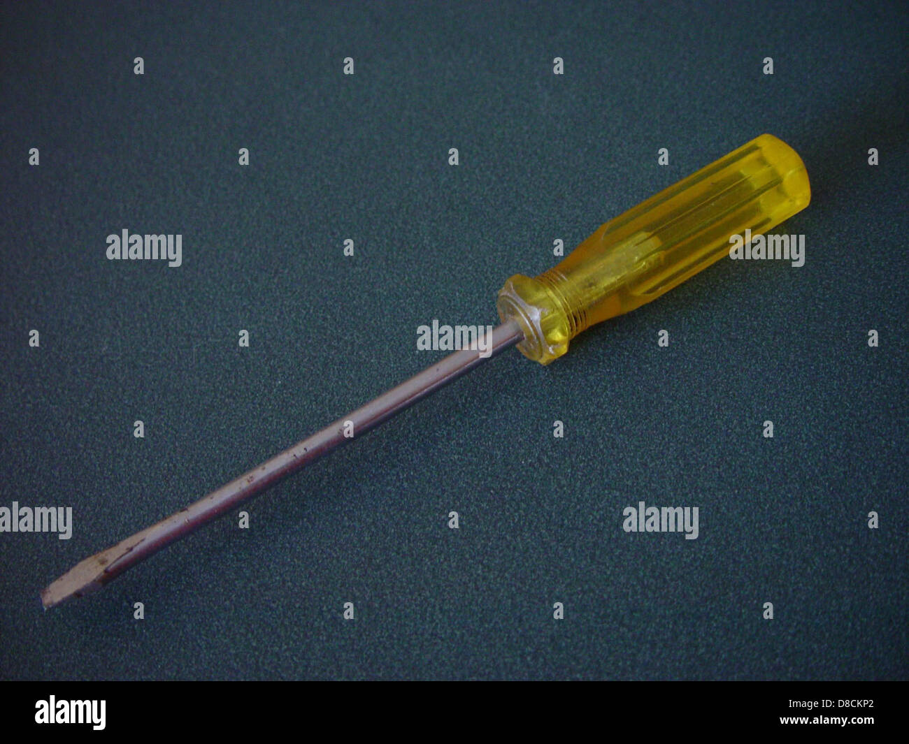 Flat minus screwdriver on table Stock Photo - Alamy