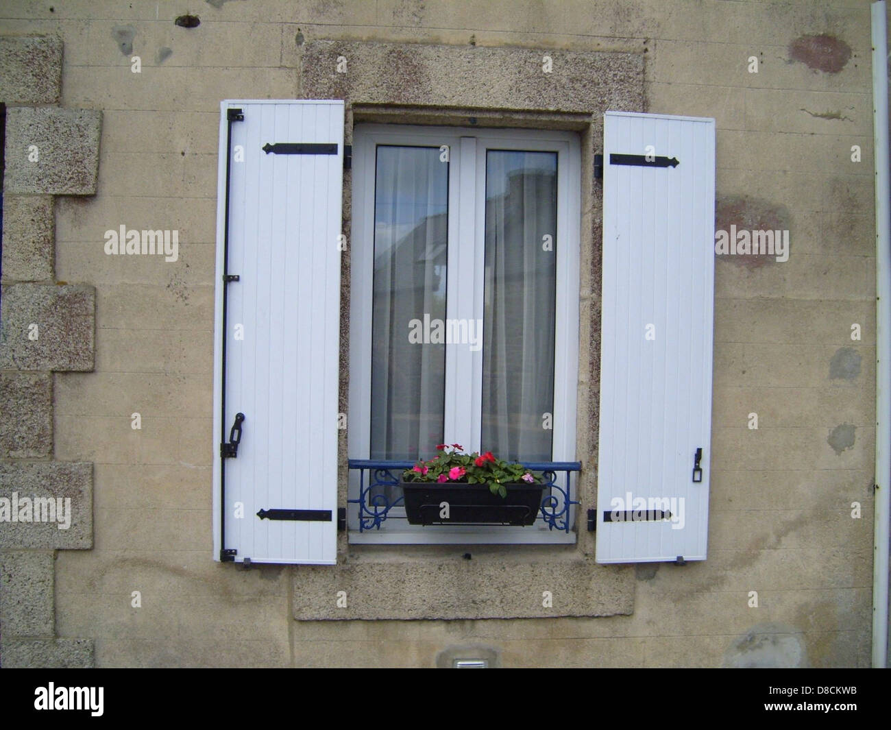 Flowered window with shooter Stock Photo - Alamy