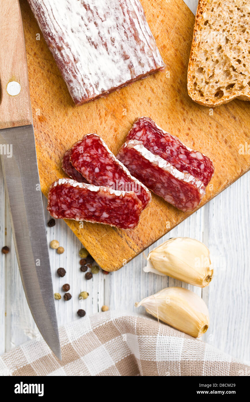 gourmet sliced salami on kitchen table Stock Photo - Alamy