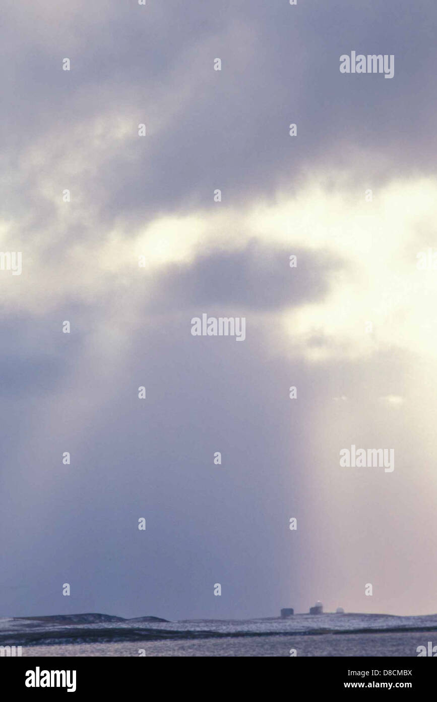 A sky filled with dense fog and clouds, creating a soft, overcast ...