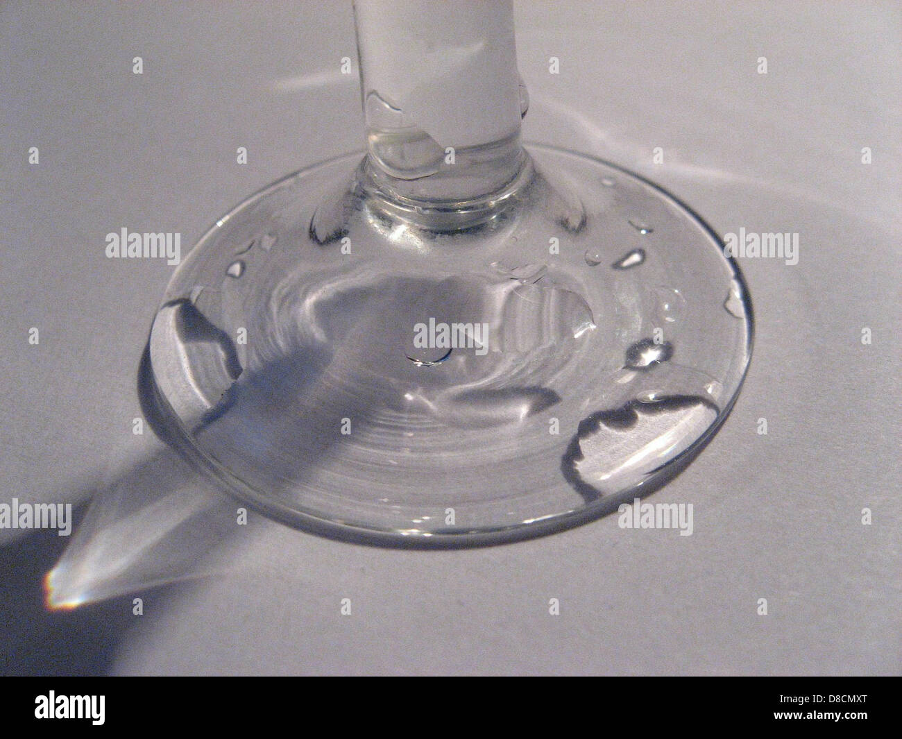 A close-up of a glass surface with water drops, highlighting the ...