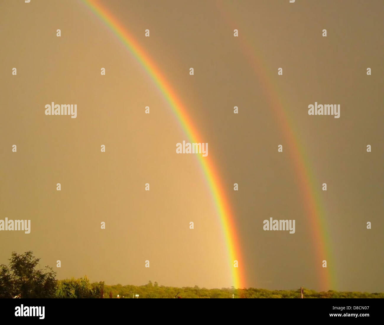 A rare and beautiful sight of a golden rainbow appearing in the sky ...
