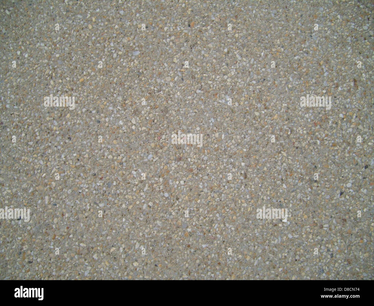 This image shows gravel mixed with concrete, creating a textured ...