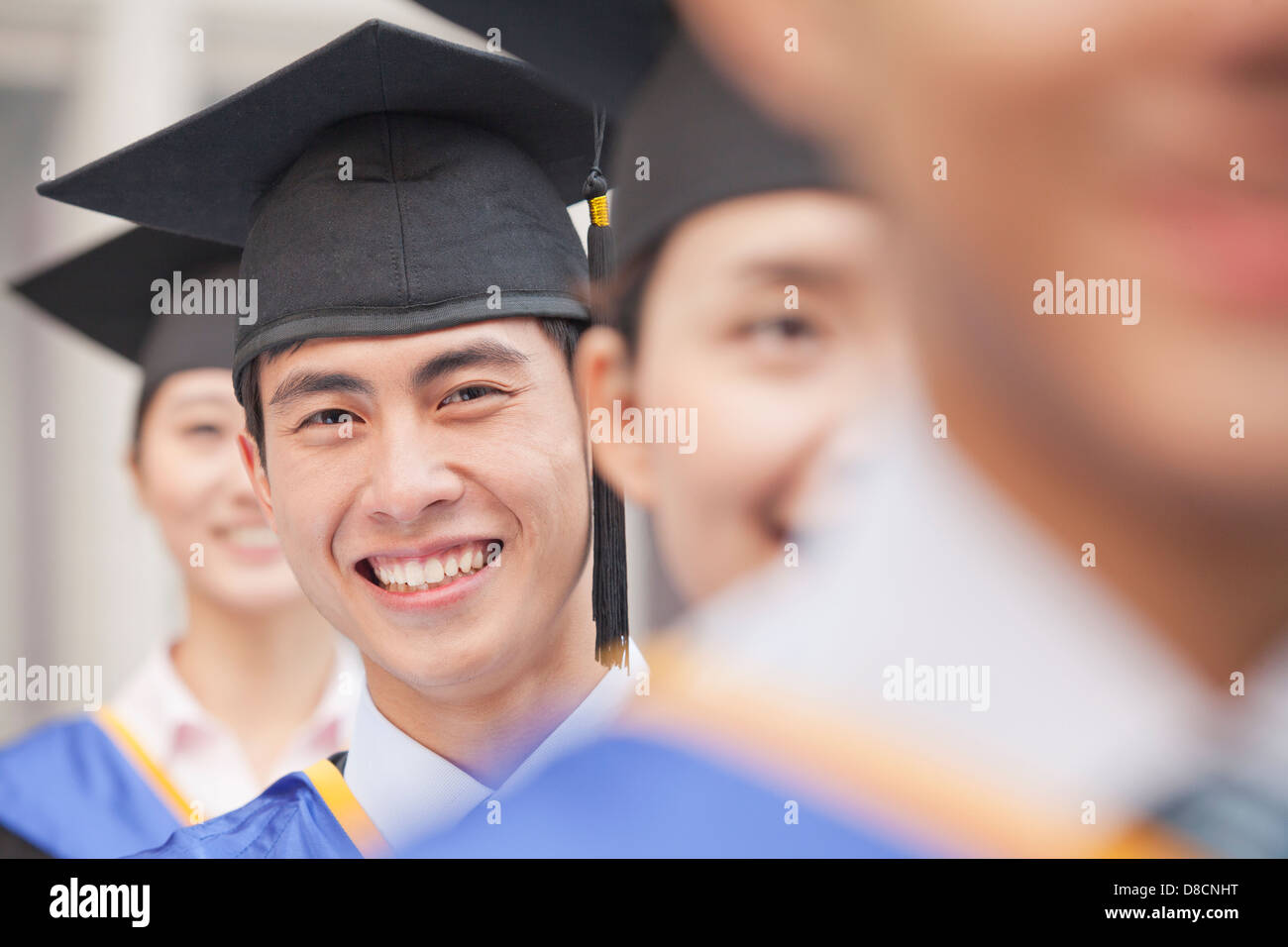 Four University Graduates Smiling High Resolution Stock Photography and ...