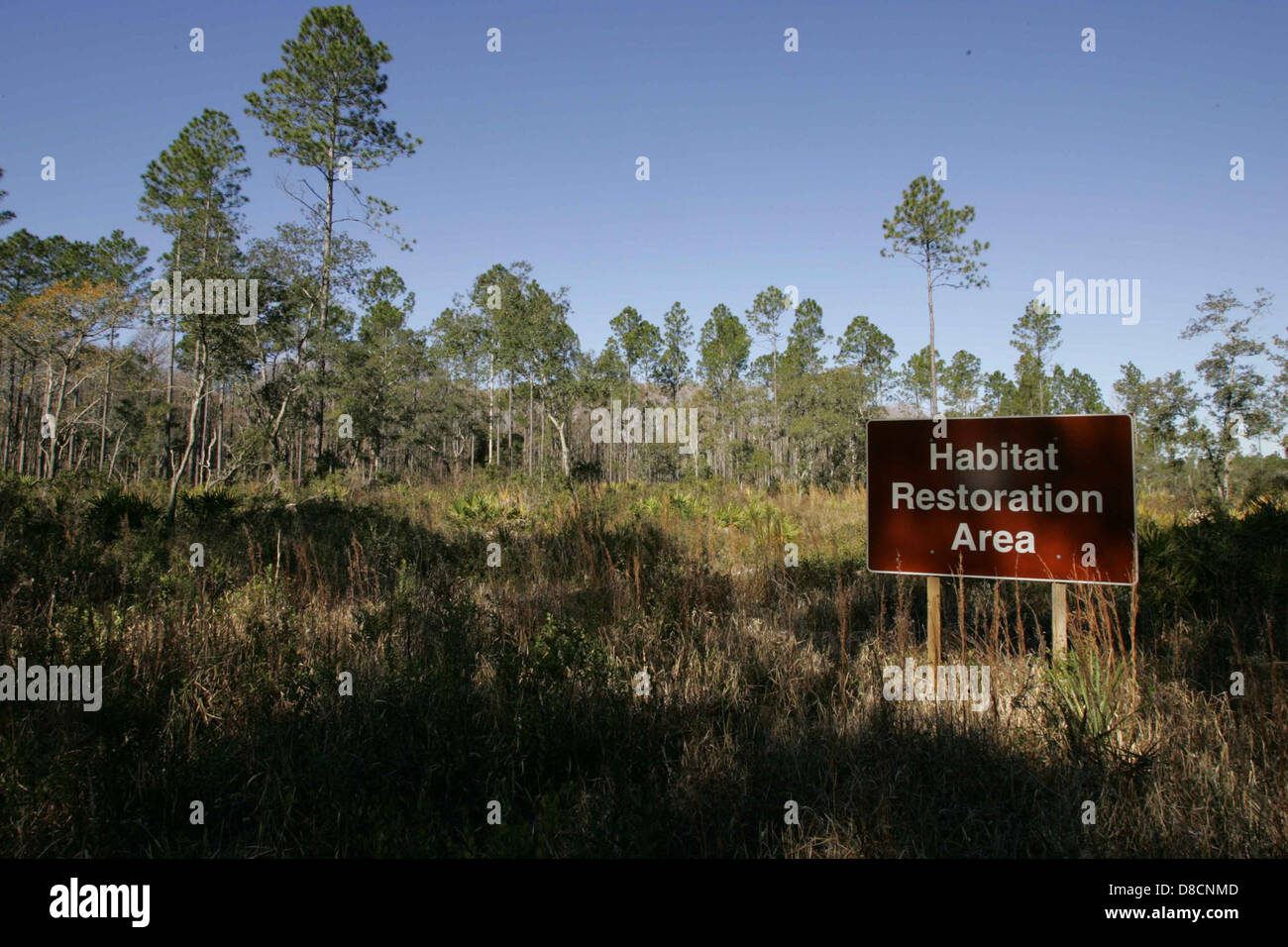 A sign marking a habitat restoration area, which is dedicated to the ...