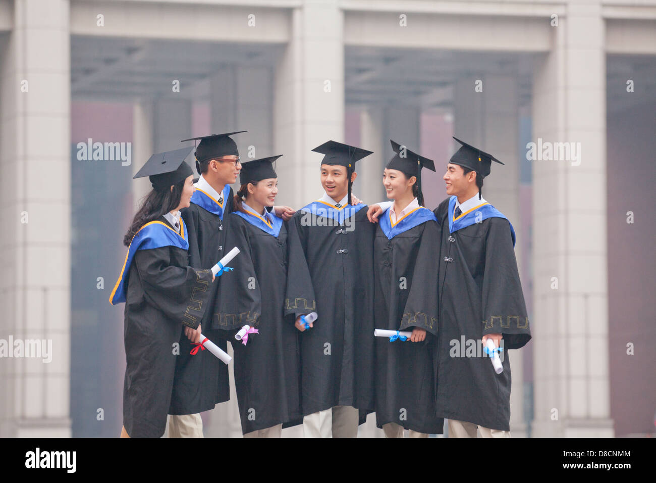 Group of Graduate Students Standing Together with Diplomas Stock Photo ...
