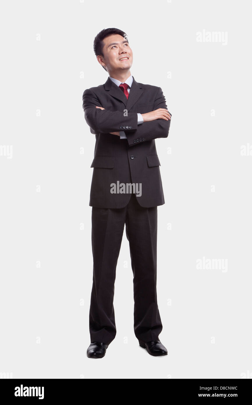 Businessman Looking Up, Full Length Stock Photo - Alamy