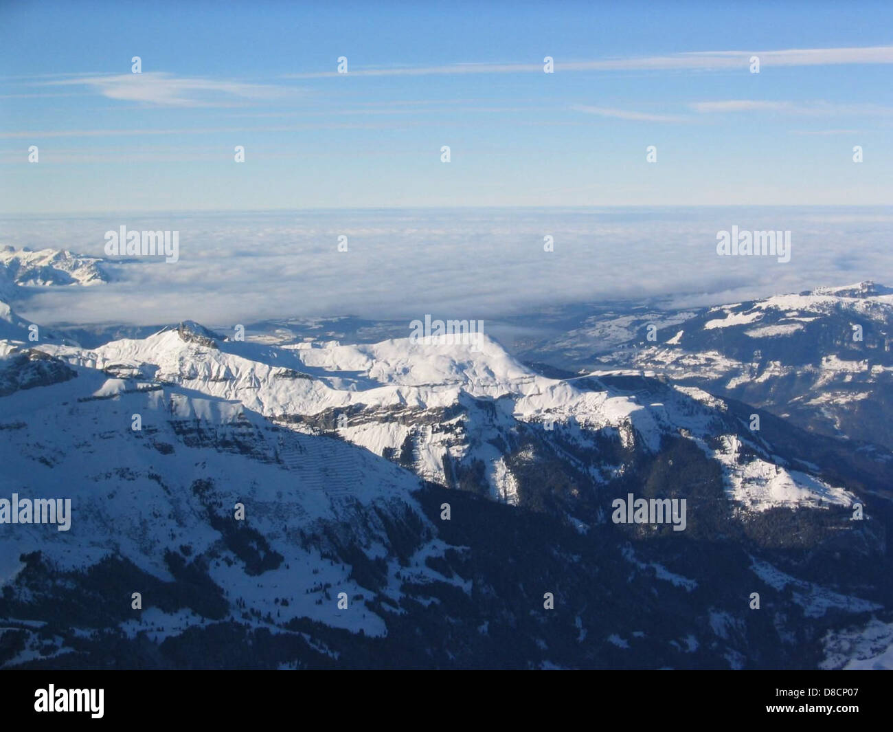 A towering mountain peak is visible, reaching high above the ...