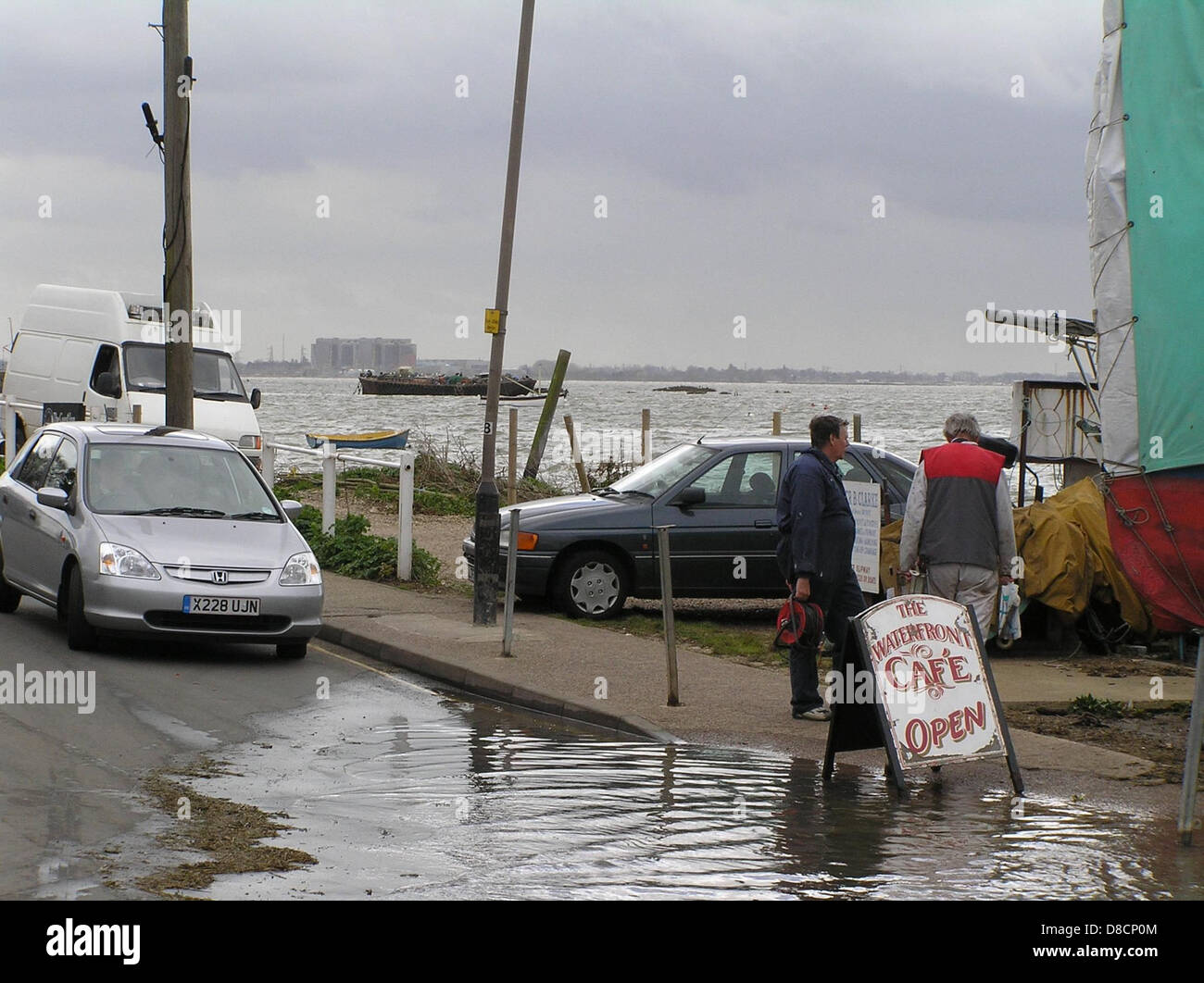 The high tide at Mersea Island showcases the rising waters, gently ...