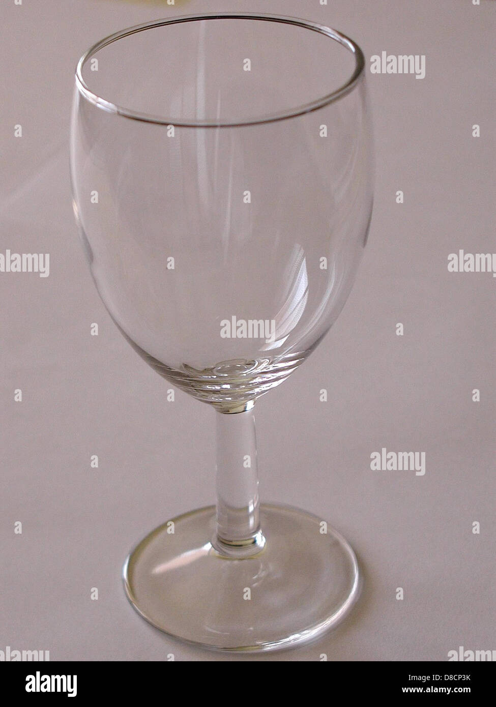 This image shows a hollow, empty glass. The clear glass has a simple ...