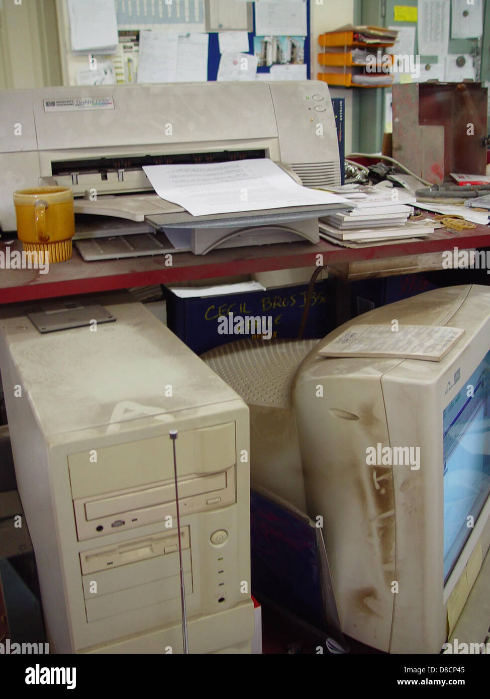 A home computer setup featuring a keyboard, monitor, and other ...