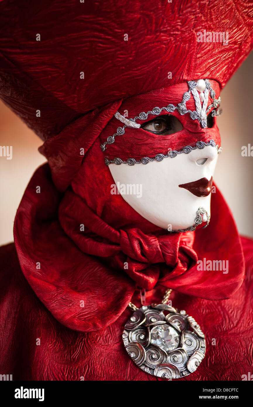 A woman posing with a red Carnival costume during the Venice Carnival ...