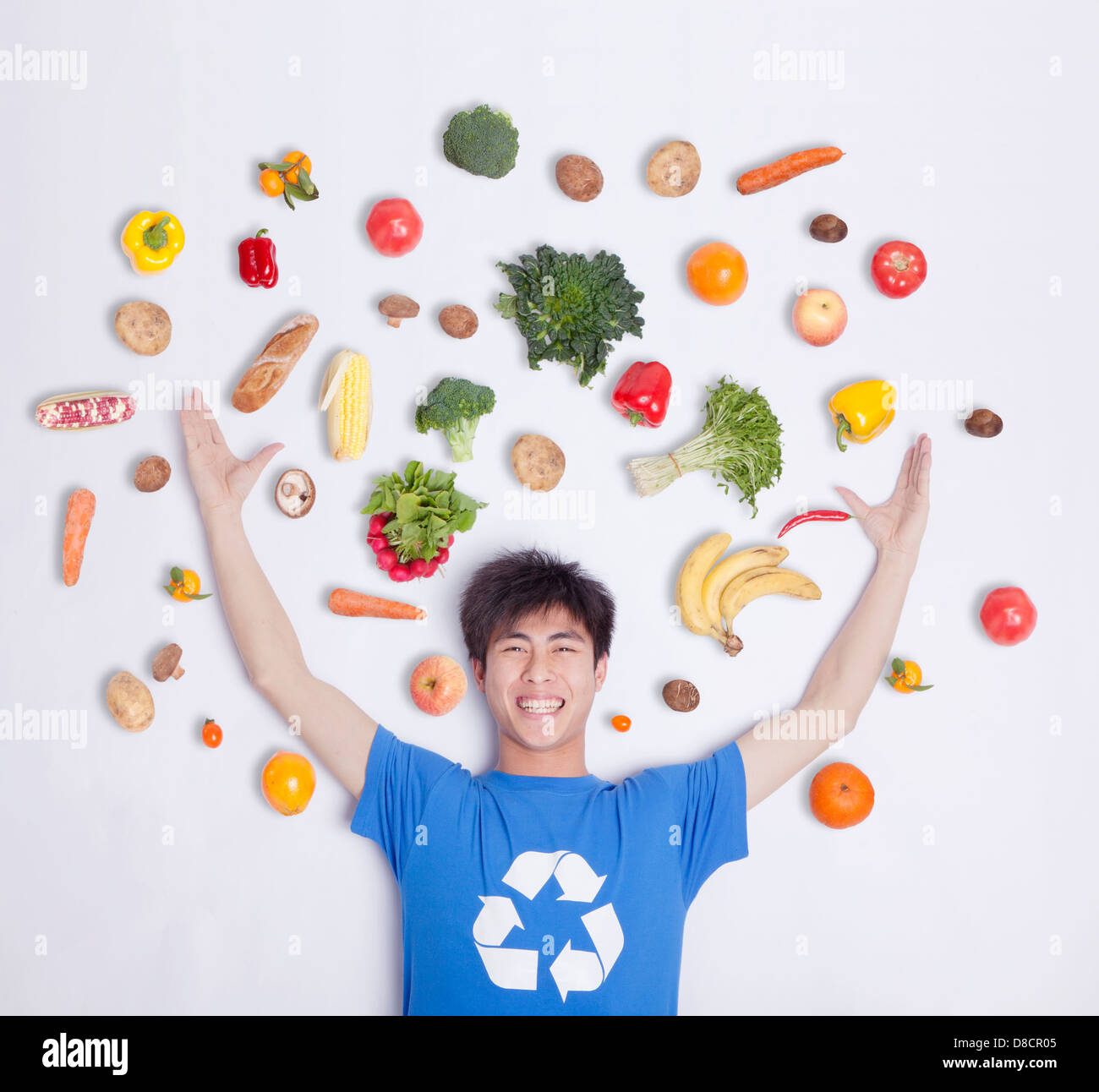 Young man with fresh fruit and vegetables, studio shot Stock Photo - Alamy