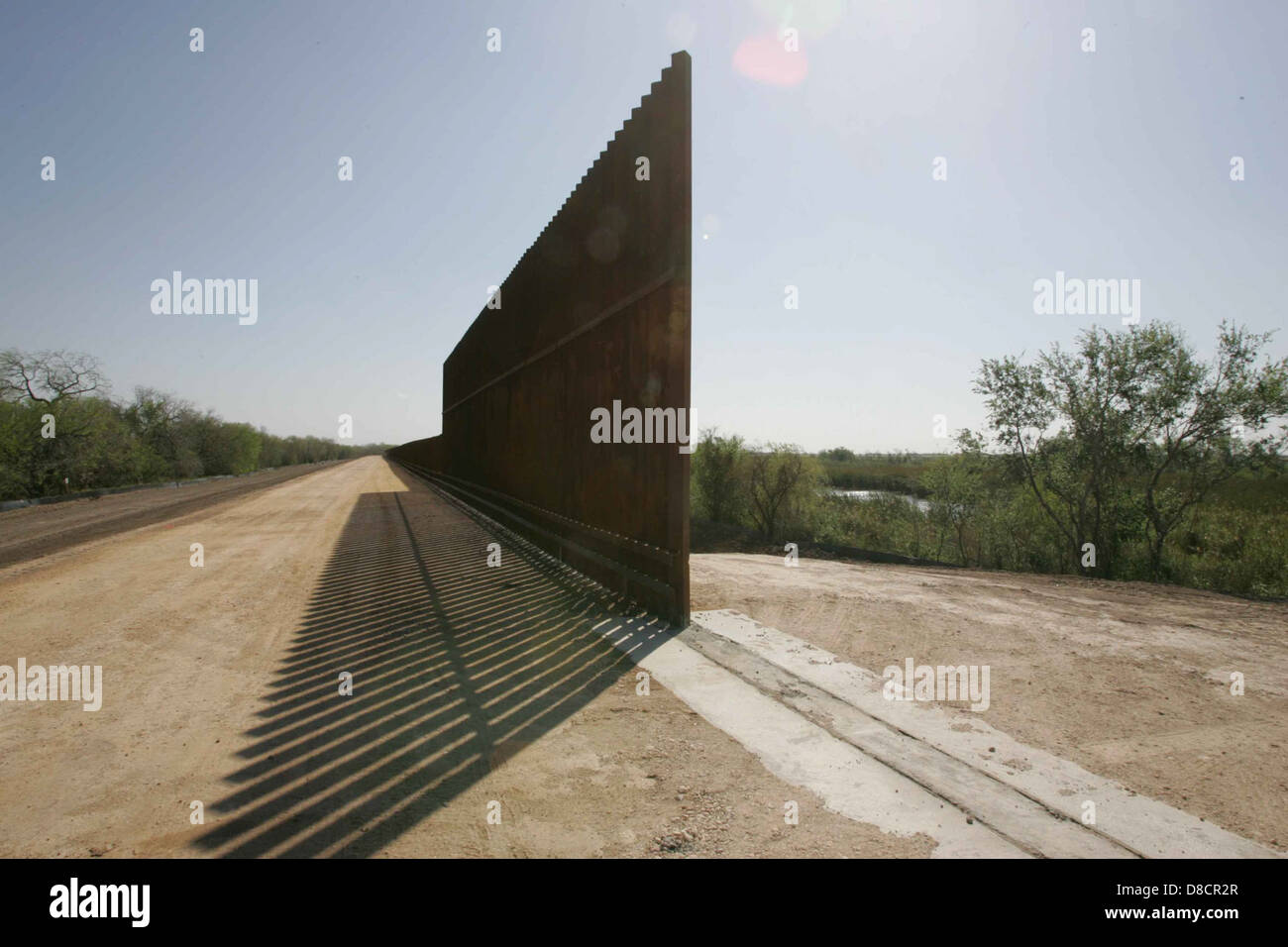 A shadow cast by an iron fence, showing the intricate details of the ...