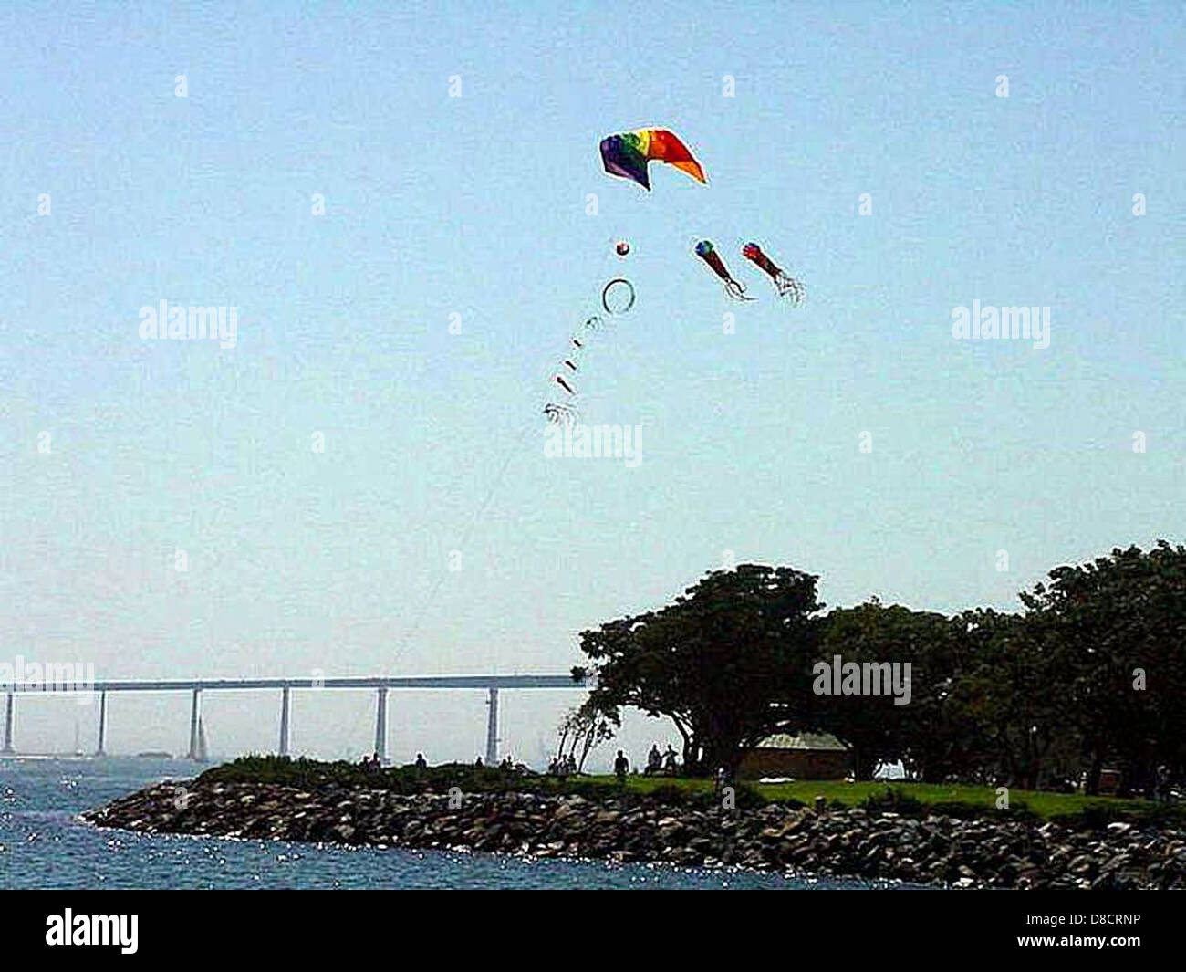 This image features a kite flying on the beach, often a recreational ...
