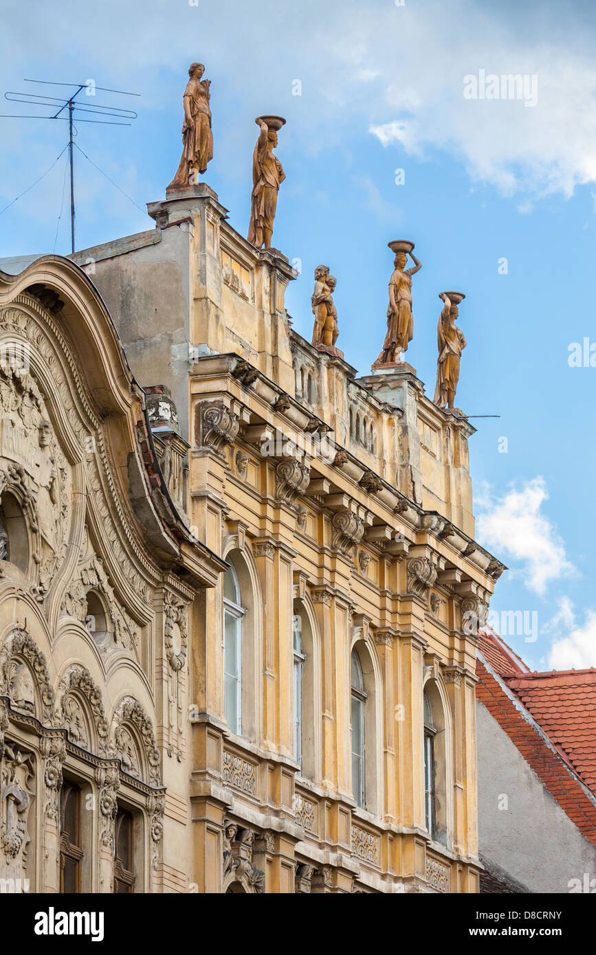 Old classic architecture building with statues on the frontispiece in ...