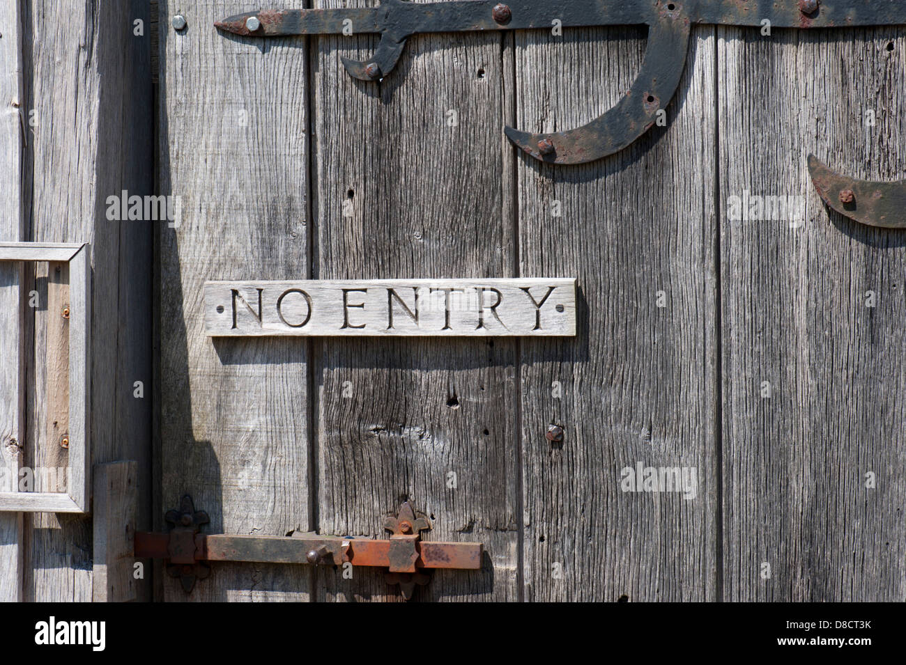 No Entry sign on old wooden door in old wall, West Sussex, UK Stock ...