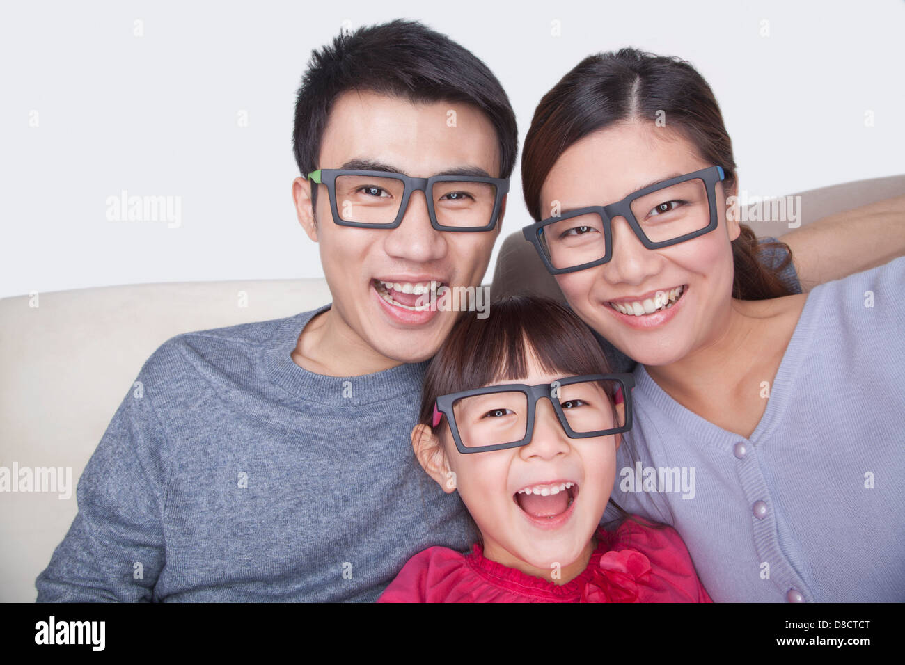 Portrait of Family wearing black glasses, studio shot Stock Photo - Alamy