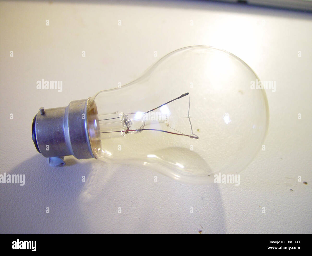 A clear light bulb with a bayonet fitting, commonly used in household ...