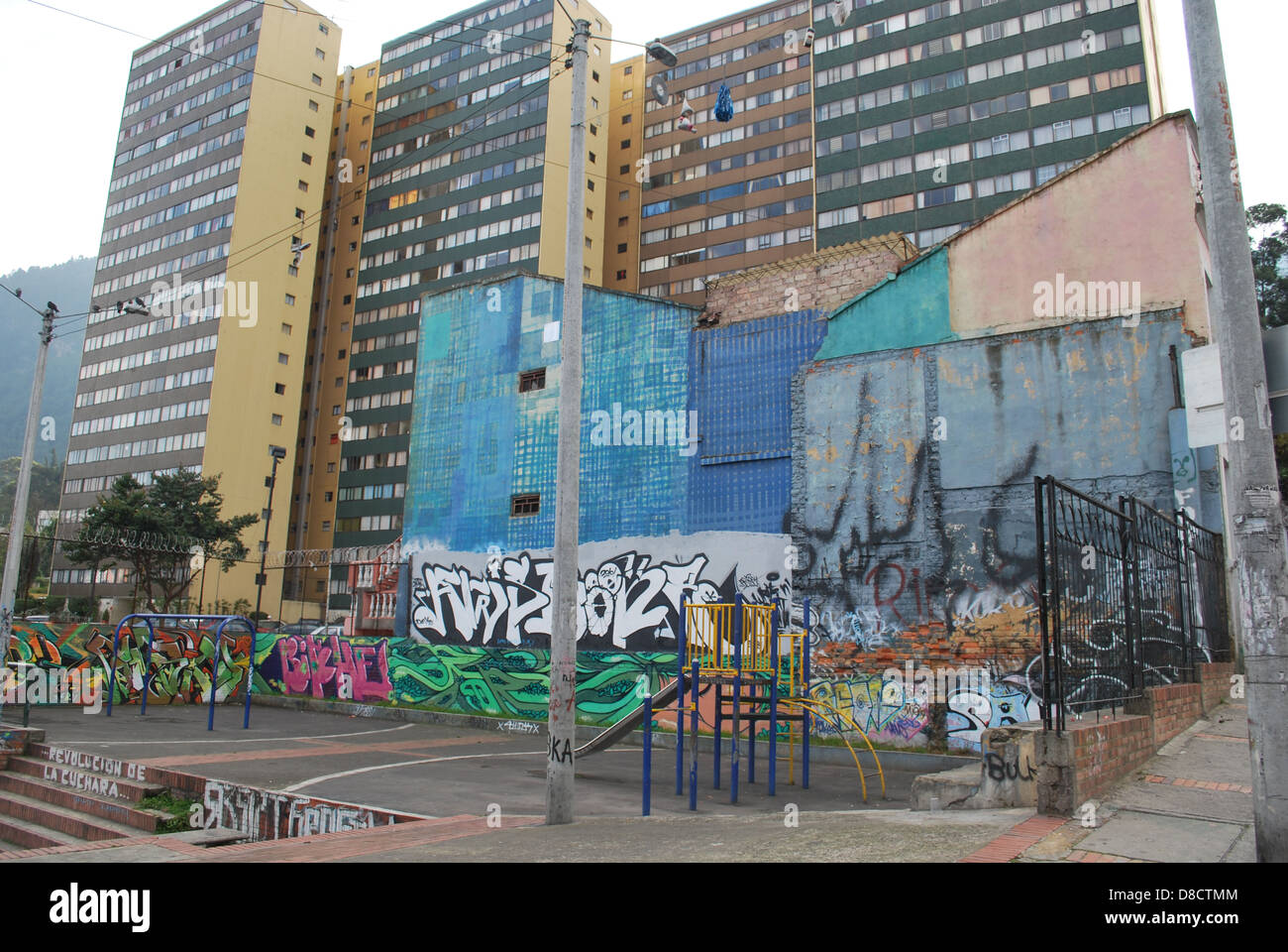 landscape shot of three tower blocks with graffiti in the foreground ...